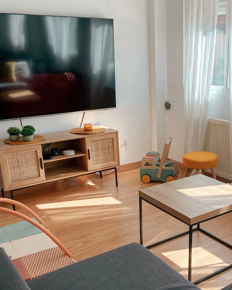 Boho Chic TV Stand: Natural Rattan Cabinet with Black Metal Legs" | revvvd